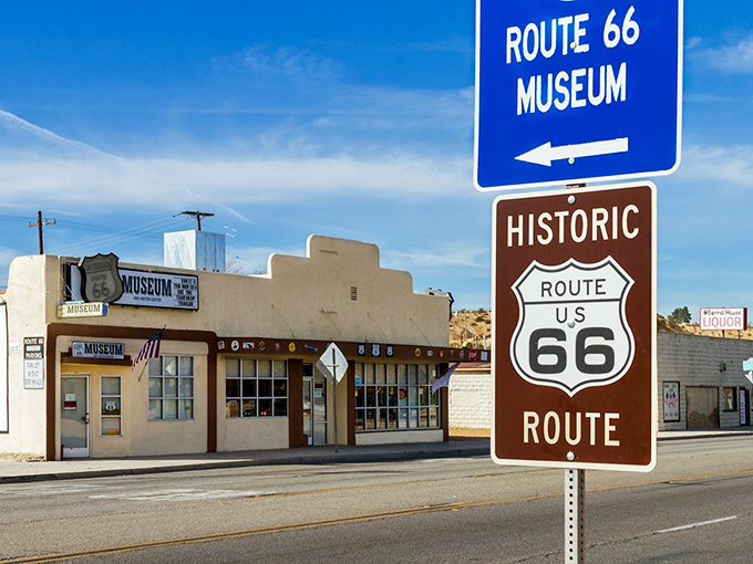 The museum's facade features a vintage green truck with cartoon eyes that seems ready to share tales from its days cruising the Mother Road.