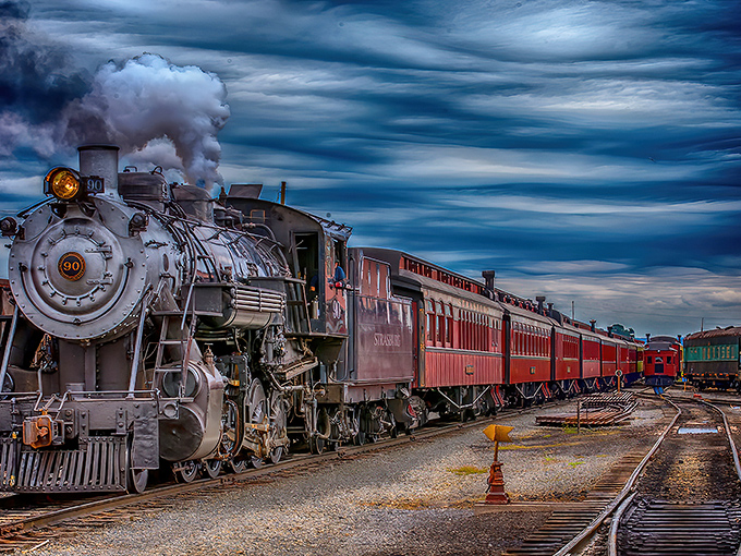 Steam and dreams collide as this magnificent locomotive cuts through Lancaster County's emerald farmland, a moving postcard from America's golden age of rail.