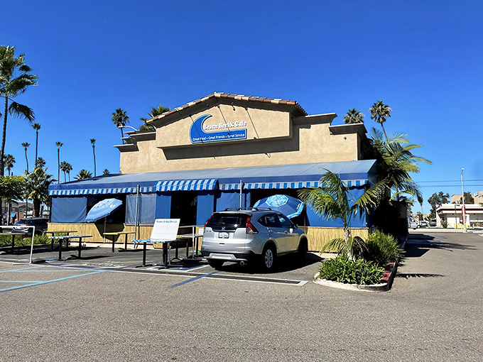 The blue-striped awnings and palm trees frame Beach Break Cafe like a postcard from coastal paradise. California breakfast dreams are made of this.