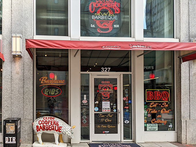 The barbecue beacon of downtown Raleigh beckons with neon signs and a painted pig sentinel. This unassuming storefront houses smoky treasures that have drawn devotees for generations.