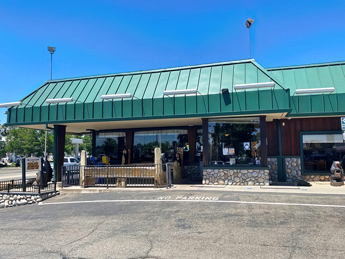 The iconic green roof of Black Bear Diner in Redding stands like a woodland beacon for hungry travelers, promising comfort food salvation just off Interstate 5.