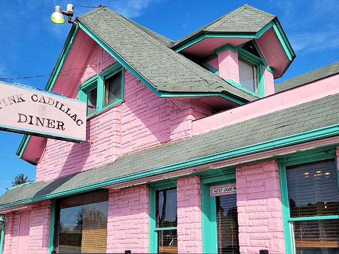 The Pink Cadillac Diner stands proudly against the Virginia sky, its bubblegum exterior and mint trim promising nostalgic delights within.