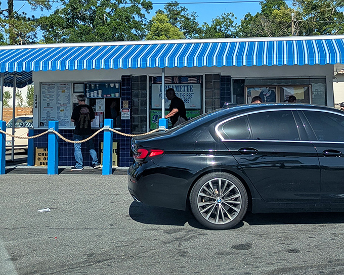 The blue-and-white striped awning of Dreamette stands like a beacon of frozen hope in Jacksonville's heat. Classic Americana at its sweetest.