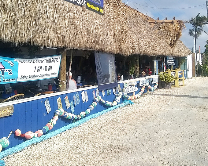 Thatched-roof paradise alert! Porky's colorful exterior with its blue railings and buoy decorations screams "authentic Keys experience" before you even step inside.
