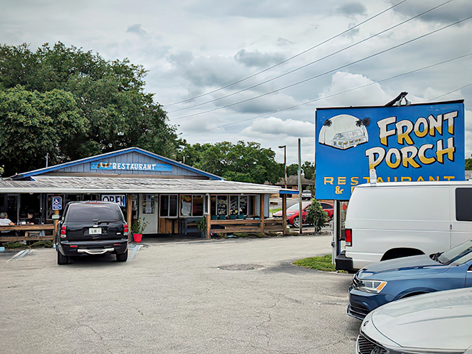 The promise of Southern comfort beckons from this rustic wooden facade. That red door isn't just an entrance&mdash;it's a portal to flavor country.