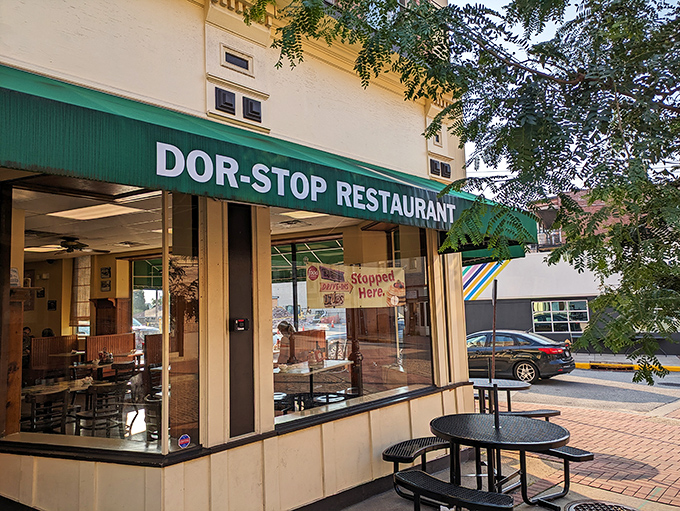 The iconic green awning of Dor-Stop beckons like an old friend. No fancy frills needed when the food inside speaks volumes.