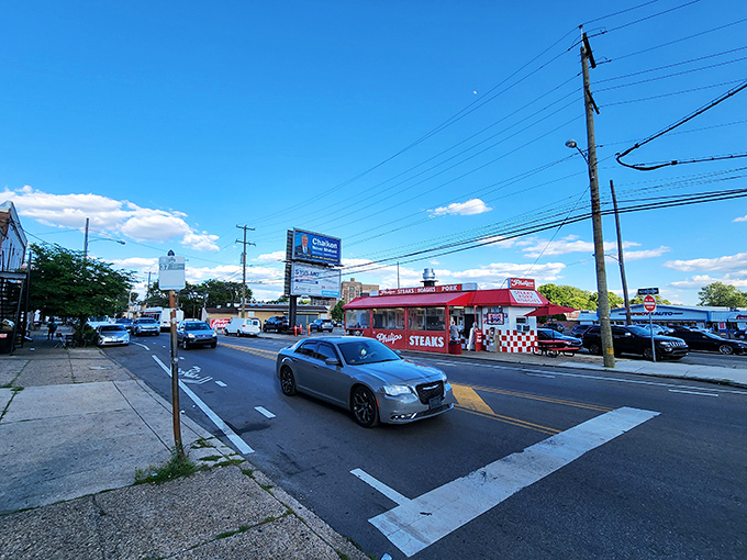 The red-and-white checkered beacon of South Philly stands proud against the blue sky, a siren call to cheesesteak pilgrims from across Pennsylvania.