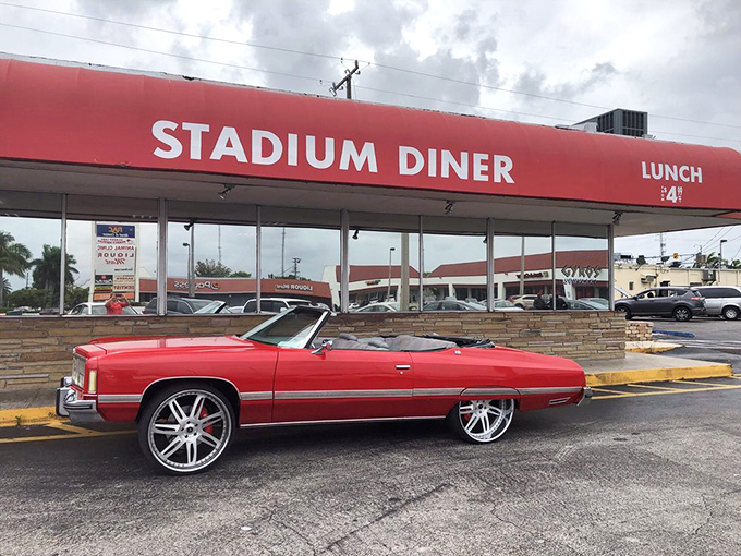 The iconic red awning of Stadium Diner stands out like a beacon for hungry travelers. No fancy frills, just the promise of honest-to-goodness comfort food inside.