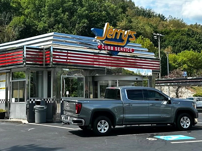 The gleaming chrome and neon of Jerry's Curb Service isn't just a restaurant sign&mdash;it's a time machine to when drive-ins ruled and dinner came with a side of nostalgia.
