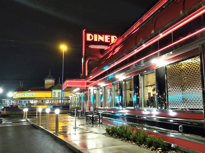 The gleaming chrome exterior of THE DINER shines like a beacon of hope for hungry travelers. This isn't just a restaurant&mdash;it's a time machine with a menu.