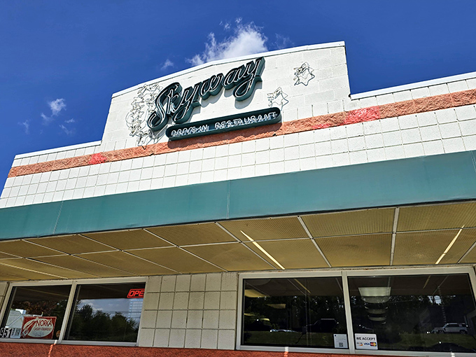 The classic mid-century facade of Skyway Drive-In stands proudly against an Ohio blue sky, a time capsule of American dining nostalgia.