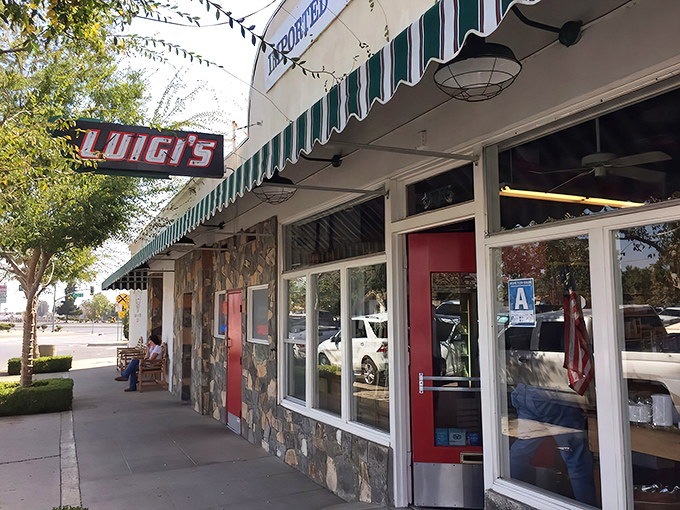 That Italian flag bench outside Luigi's practically begs you to sit and contemplate your impending food coma.