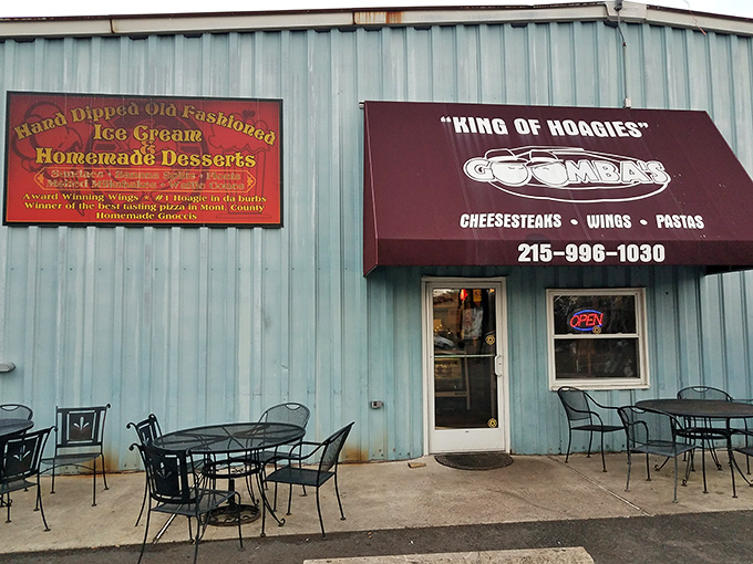 The unassuming blue exterior of Goombas proudly declares its royal status as "KING OF HOAGIES" – a bold claim that, as you'll discover, is absolutely justified.