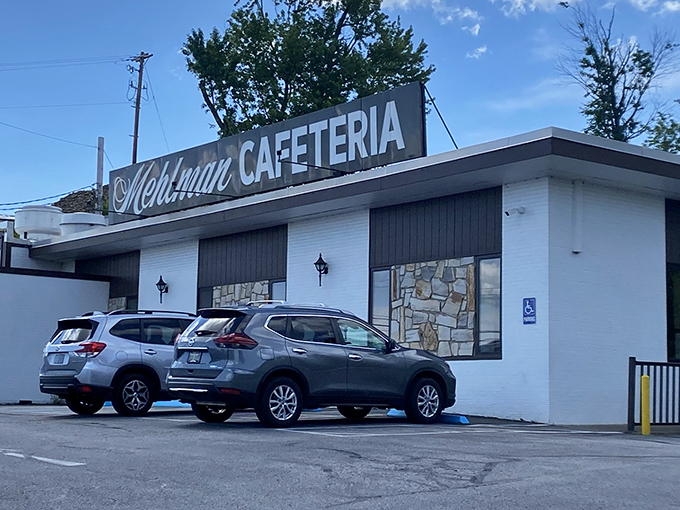 That packed parking lot tells the whole story - when locals choose this over chain restaurants, magic happens inside.