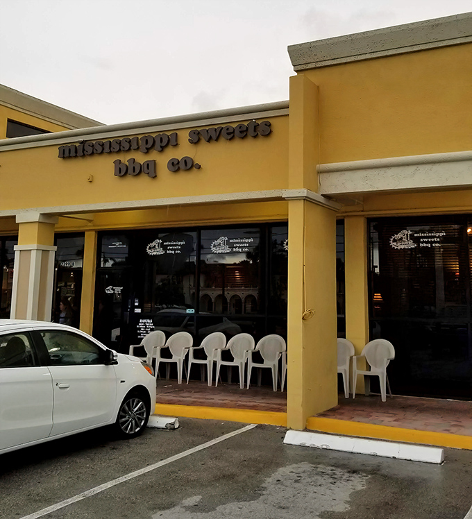 That cheerful yellow exterior might fool you, but inside lies barbecue magic that'll change your life forever.