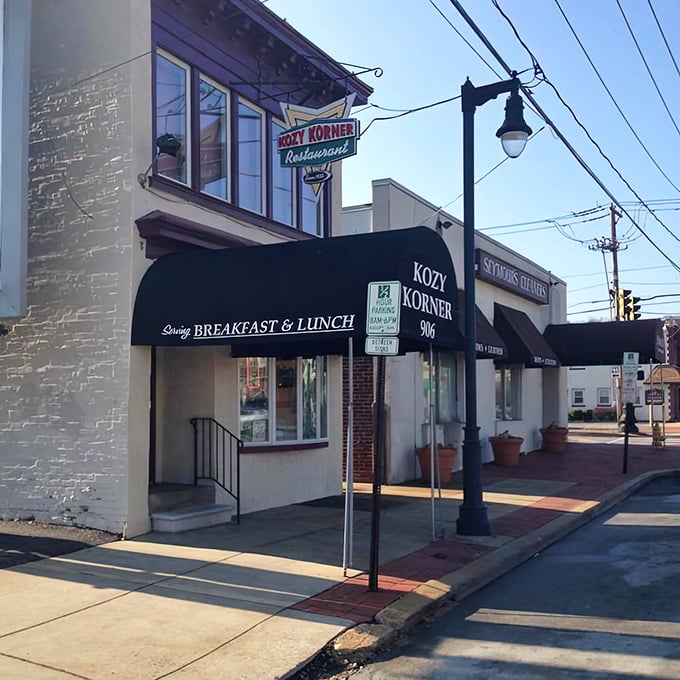 The classic black awning and vintage neon sign of Kozy Korner stand as a beacon of breakfast hope on this Wilmington corner. Time seems to slow down here.