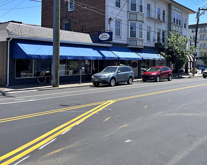 The blue awnings of The Echo beckon like an old friend on Cincinnati's Edwards Road, promising comfort food and zero pretension