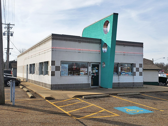 The turquoise pillar reaches skyward like a mid-century rocket ship, announcing to hungry travelers: "The 1950s are alive and well in Alliance, Ohio."