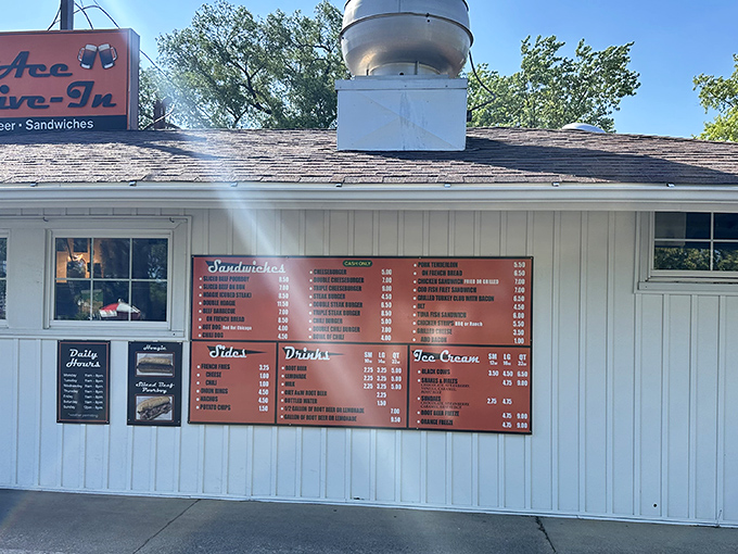 The iconic orange sign of Pierson's Ace Drive-In stands as a beacon of nostalgia in Joliet, promising root beer and sandwiches that have stood the test of time.