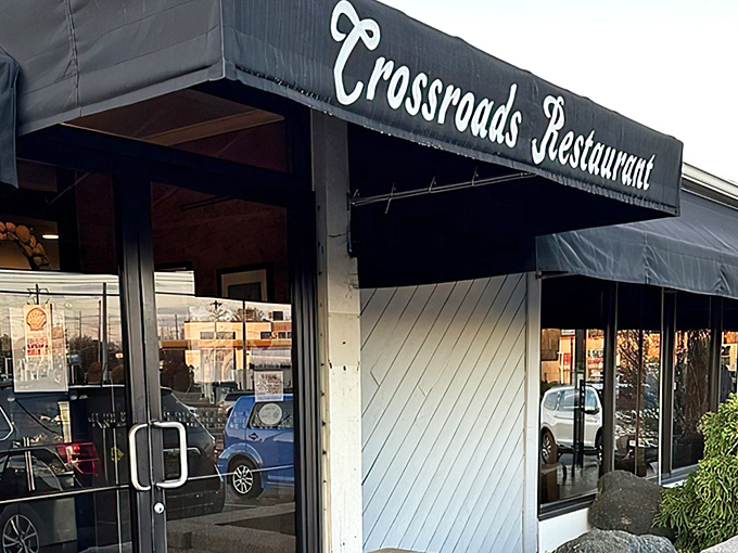 The green-striped awning of Crossroads Restaurant stands as a beacon of breakfast hope, promising comfort food salvation to hungry Delaware residents.