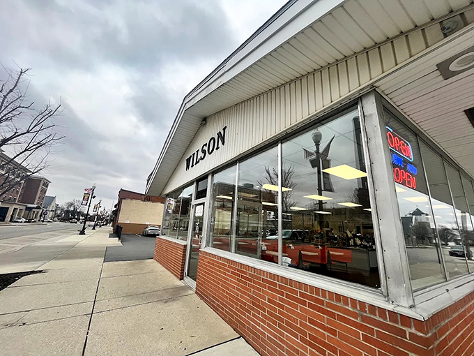 The corner storefront of Wilson's stands like a time capsule on Findlay's Main Street, beckoning hungry travelers with its vintage charm.