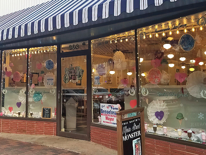 The classic striped awning and twinkling lights of Little O's beckon like a time machine disguised as a storefront. Step inside for a sweet escape from the modern world.