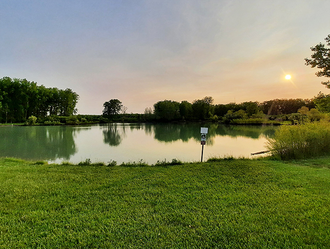 Sunset transforms Caesar Creek Lake into nature's mirror, reflecting golden skies and peaceful solitude. The perfect end to a day of outdoor adventures.