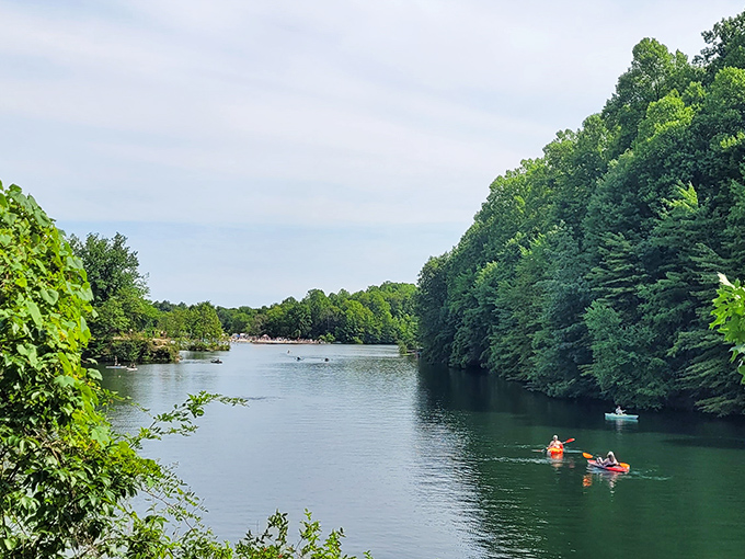Nature's own infinity pool! Kayakers glide across mirror-like waters surrounded by Ohio's lush greenery, proving paradise doesn't require a passport.