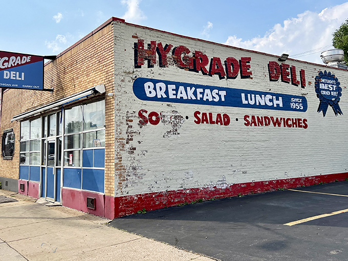 The iconic white brick exterior of Hygrade Deli stands as a beacon of sandwich salvation in Detroit, promising "Detroit's Best Corned Beef" since 1955.