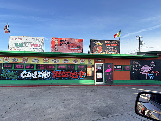 The vibrant exterior of Los Cuatro Nietos announces itself with colorful murals and flags, like a culinary carnival beckoning hungry passersby.