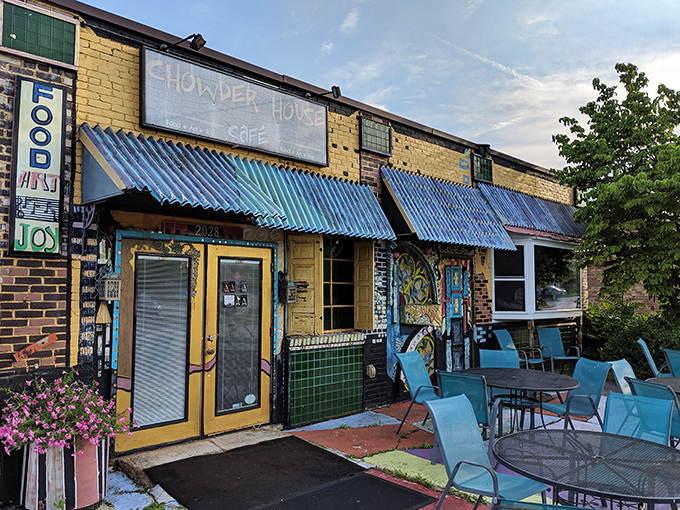 The sunshine-yellow exterior with vibrant blue awnings feels like stumbling upon a secret culinary treasure map where X marks the delicious spot.