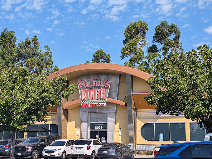 The retro-futuristic facade of Richie's Diner stands proudly against the California sky, like a time portal to when breakfast was an event, not just a meal.