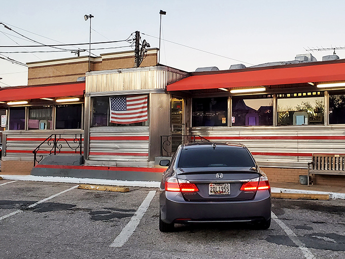 The classic silver-and-red exterior of Tastee Diner stands like a time machine on Route 1, complete with American flag proudly declaring its diner citizenship.