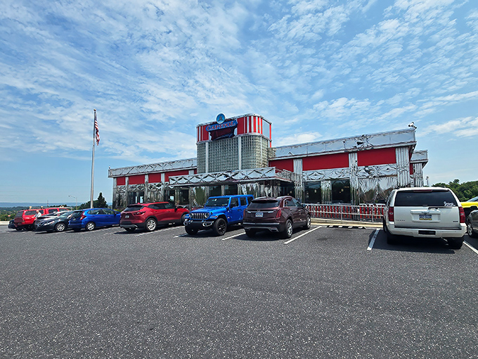 The gleaming red and silver exterior of Capitol Diner stands like a time machine to the 1950s, beckoning hungry travelers with its classic Americana charm.
