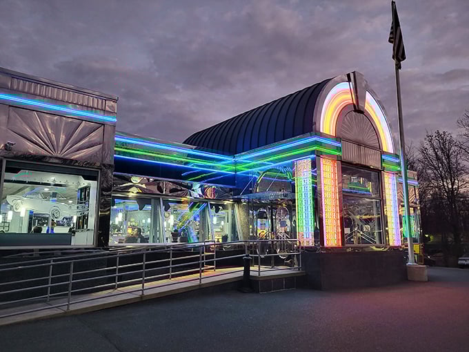 Neon dreams come true at twilight when the Americana Diner transforms into a glowing rainbow spaceship ready to beam you up for comfort food adventures.
