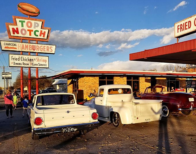 That iconic neon sign isn't just advertising&mdash;it's a time portal to when drive-ins ruled and chrome-trimmed cars were kings of the road. 