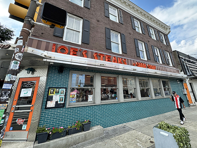 The neon glow of Joe's Steaks beckons like a lighthouse for hungry souls navigating Philadelphia's culinary waters.