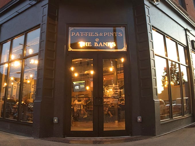The corner entrance to Patties & Pints glows with promise as dusk settles, like a beacon calling all hungry travelers home to burger paradise. 