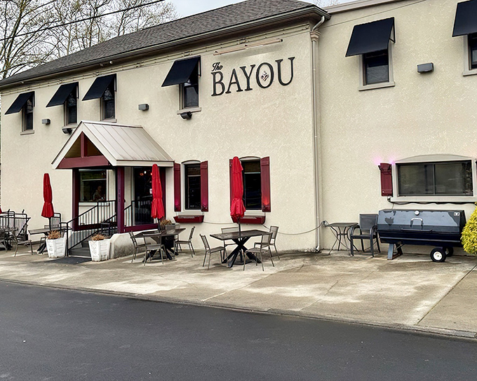 The unassuming white exterior of The Bayou might fool you, but those bright red umbrellas are practically waving "come eat something amazing" in semaphore.