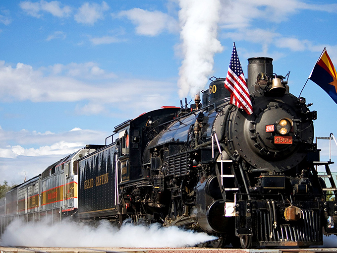 The mighty steam locomotive chugs through Arizona's high desert, a magnificent iron horse pulling passengers through time as much as through scenery.