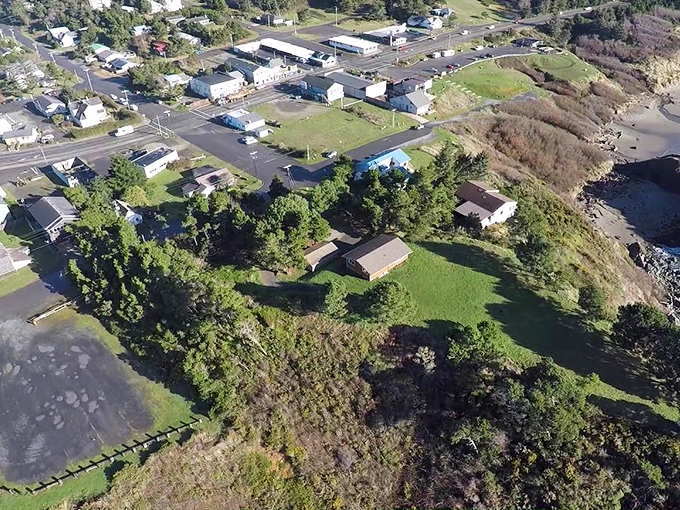 Port Orford from above looks like nature decided to create the perfect postcard&mdash;complete with dramatic headlands, a working harbor, and a town that refuses to be ordinary.
