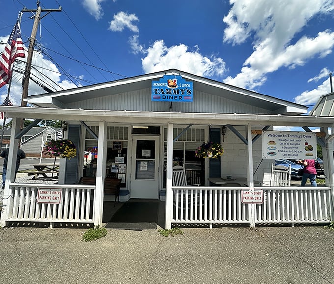 This charming white cottage with its welcoming porch practically begs you to come inside for breakfast.