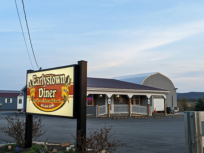 The humble roadside sign beckons like an old friend &ndash; Earlystown Diner's unassuming exterior promises authentic small-town delights within those welcoming walls. 