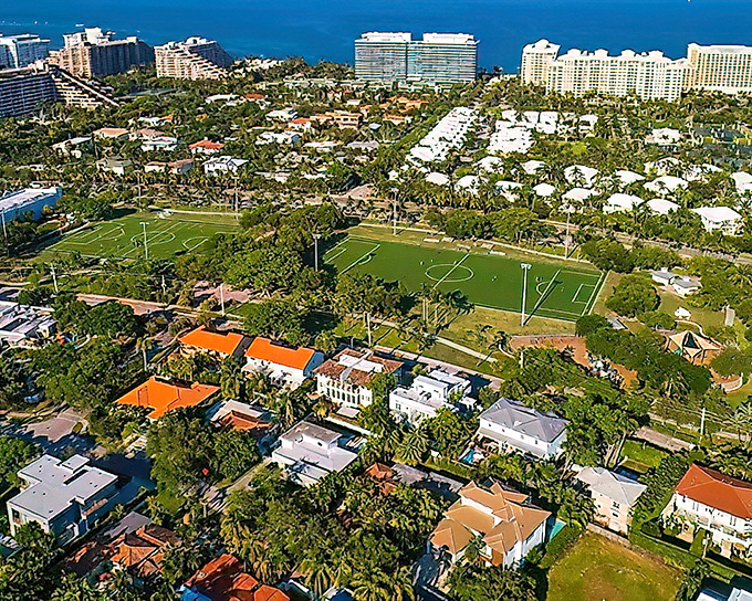 The Cape Florida Lighthouse stands like a sentinel from another era, its white tower gleaming against the turquoise waters that seem almost too perfect to be real.