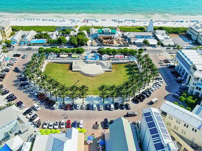 Seaside's iconic central amphitheater creates a perfect town circle, where palm trees stand sentinel around a gathering space that's equal parts community hub and architectural showpiece.