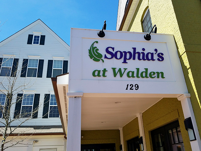 Sophia's sunny yellow exterior stands out like a cheerful beacon in Walden, promising culinary delights within those elegant columns and large windows.