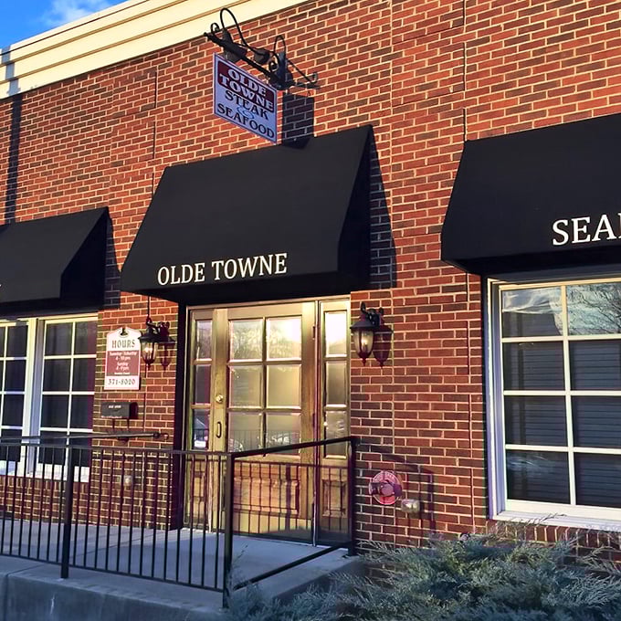 Three simple black awnings tell you everything you need to know: STEAK, OLDE TOWNE, SEAFOOD. No gimmicks, just promises they fully intend to keep.