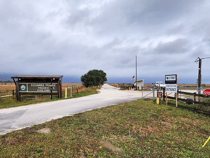 The entrance to paradise doesn't need neon lights. Just a simple sign, an open road, and the promise of wilderness beyond.