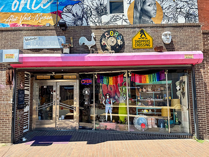 The hot pink awning serves as a beacon of hope and bargain hunting on South 5th Street, where shopping and social good collide in colorful harmony.