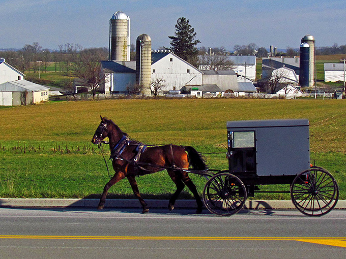 Where modern meets traditional &ndash; Amish buggies share the road with cars as they have for generations at Strasburg's iconic entrance.